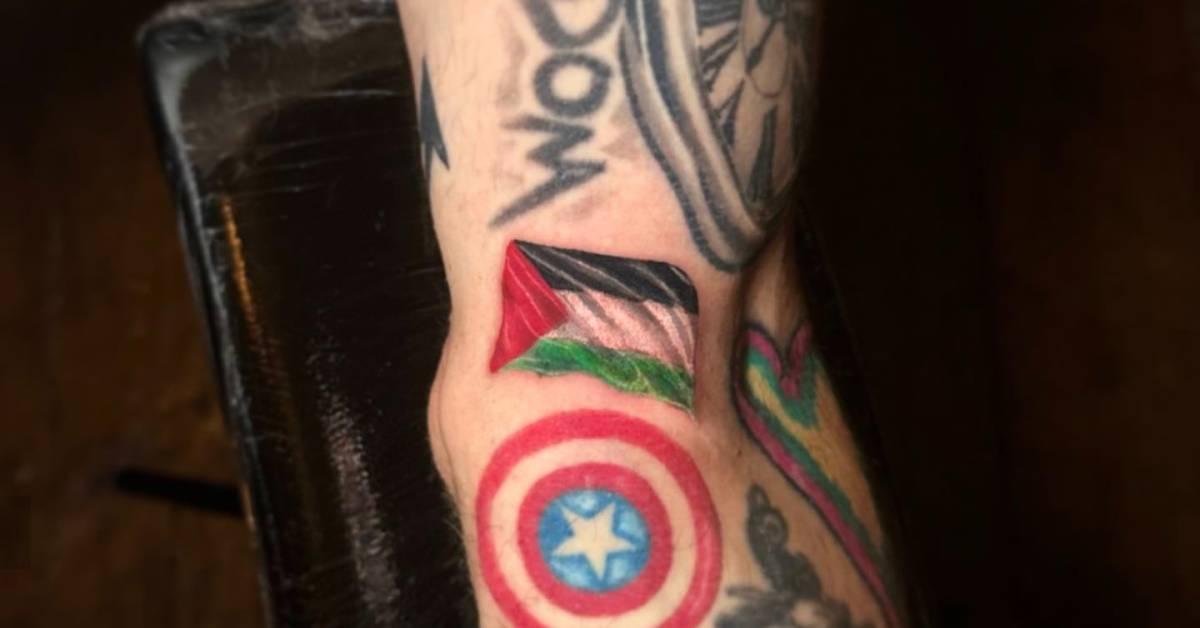 Flag of Palestine tattoo located on the elbow,