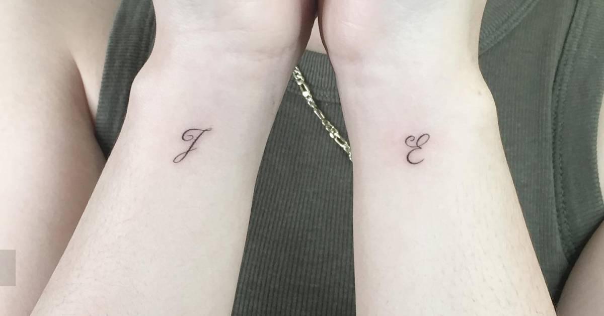Individual matching initials "J" and "E" tattoo located
