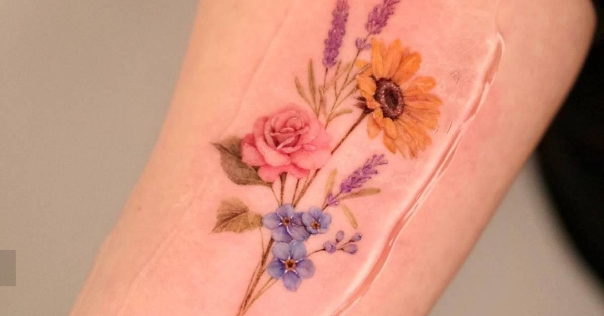 Micro-realistic flower bouquet tattoo located on the