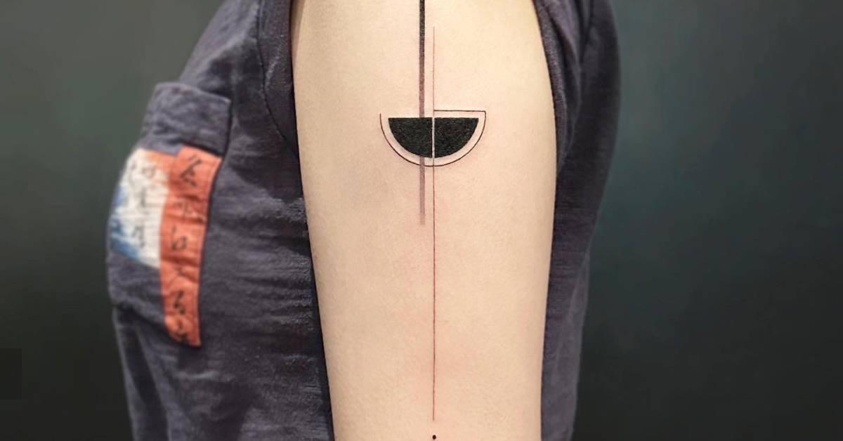 Abstract geometric tattoo located on the upper arm.