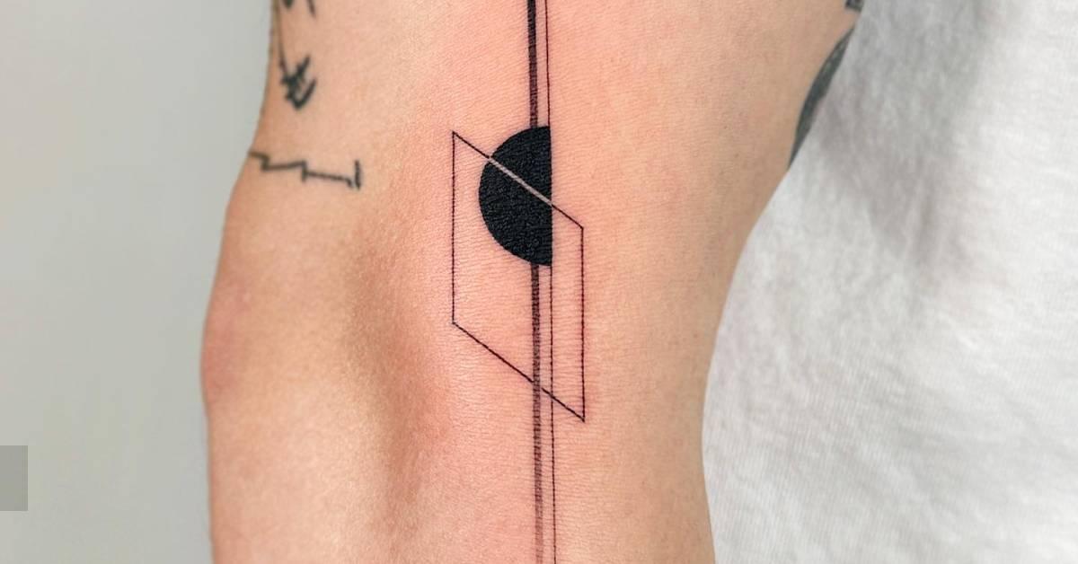 Abstract geometric tattoo located on the arm.