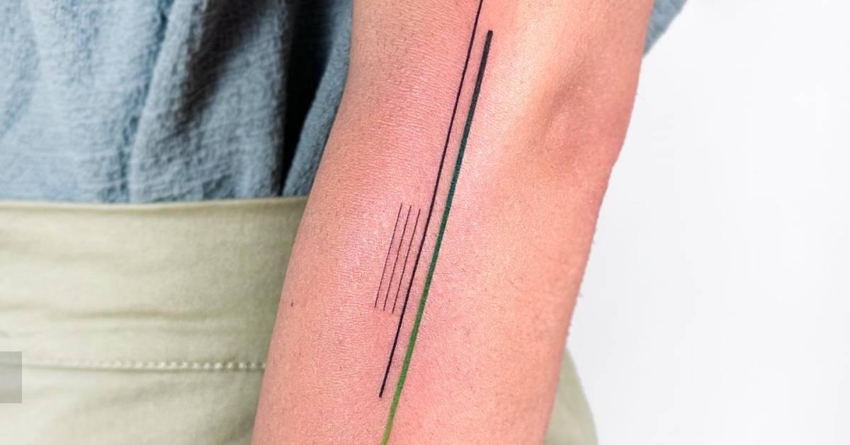Spectrum lines tattoo located on the arm.