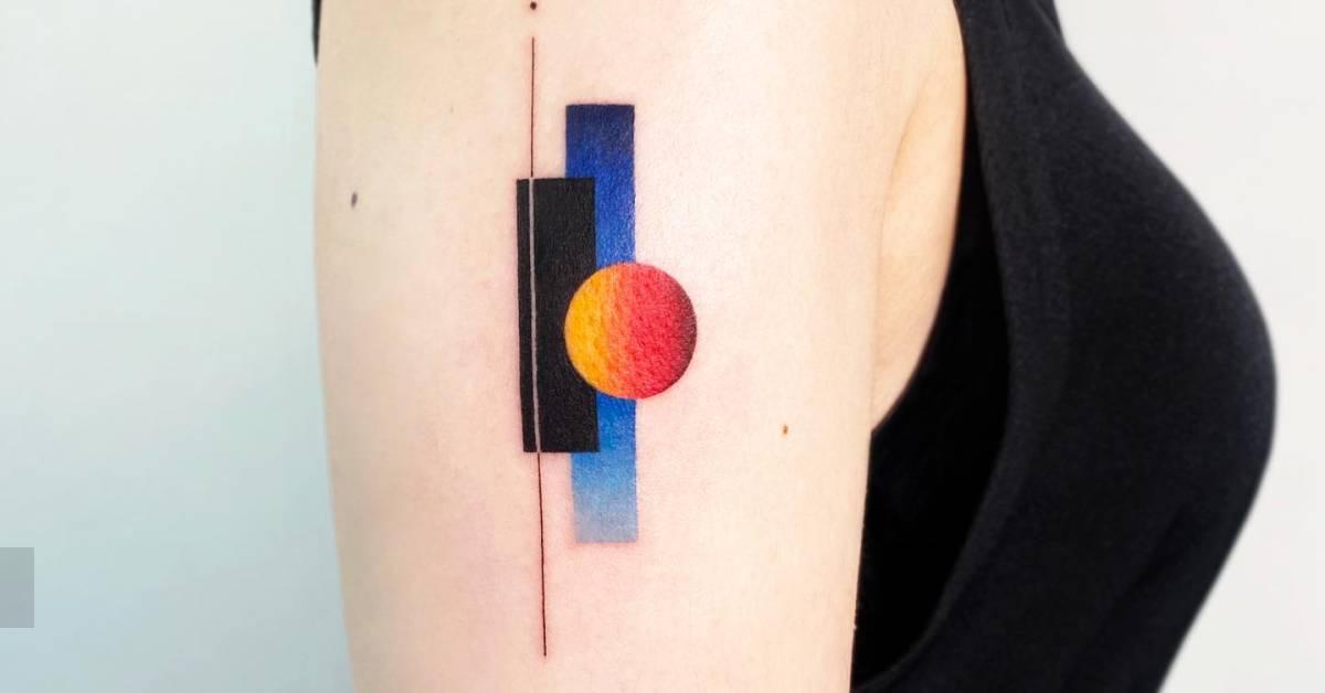 Abstract geometric tattoo placed on the upper arm.