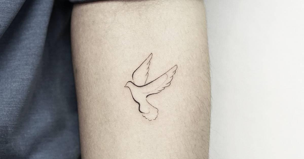 Minimalistic style dove tattoo located on the inner