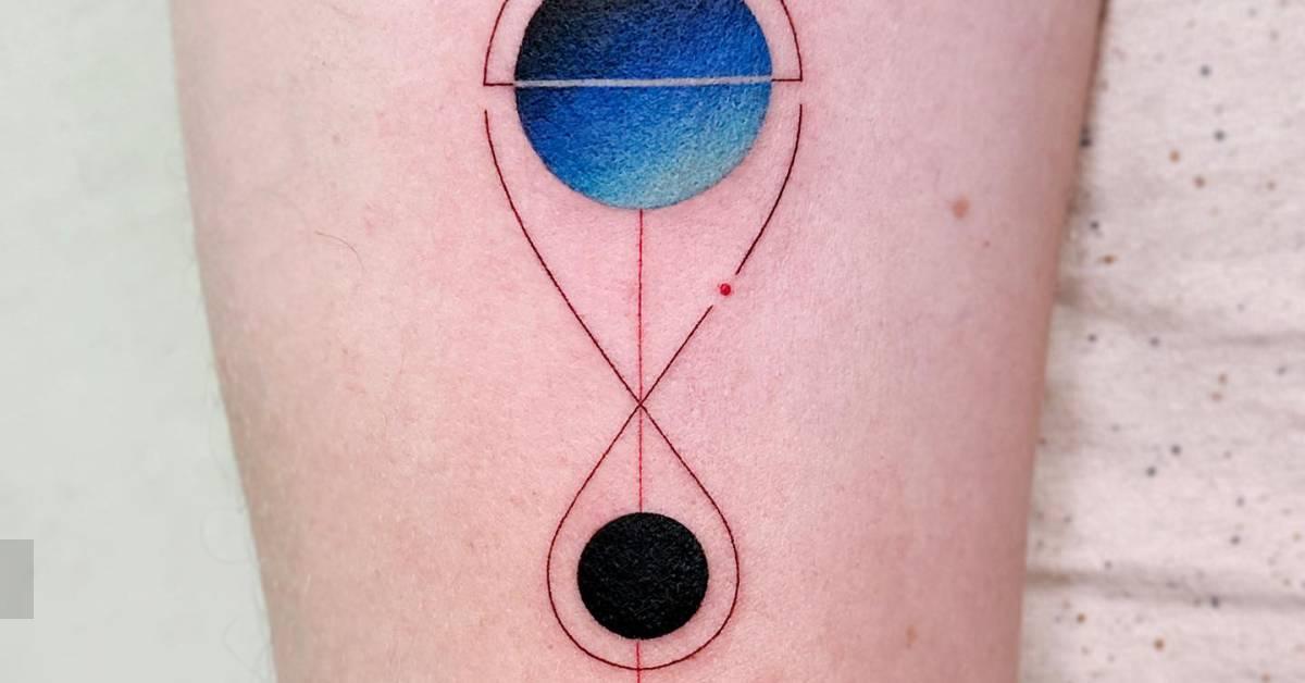 Abstract geometric tattoo done on the upper arm.