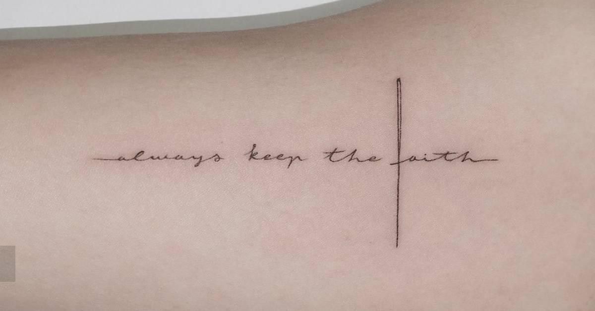 "Always keep the faith" lettering cross tattoo located