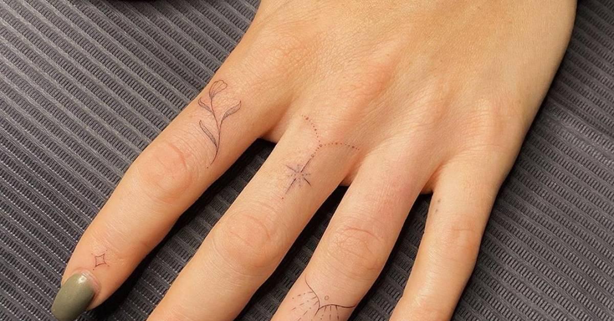Single needle freehand finger composition tattoos.