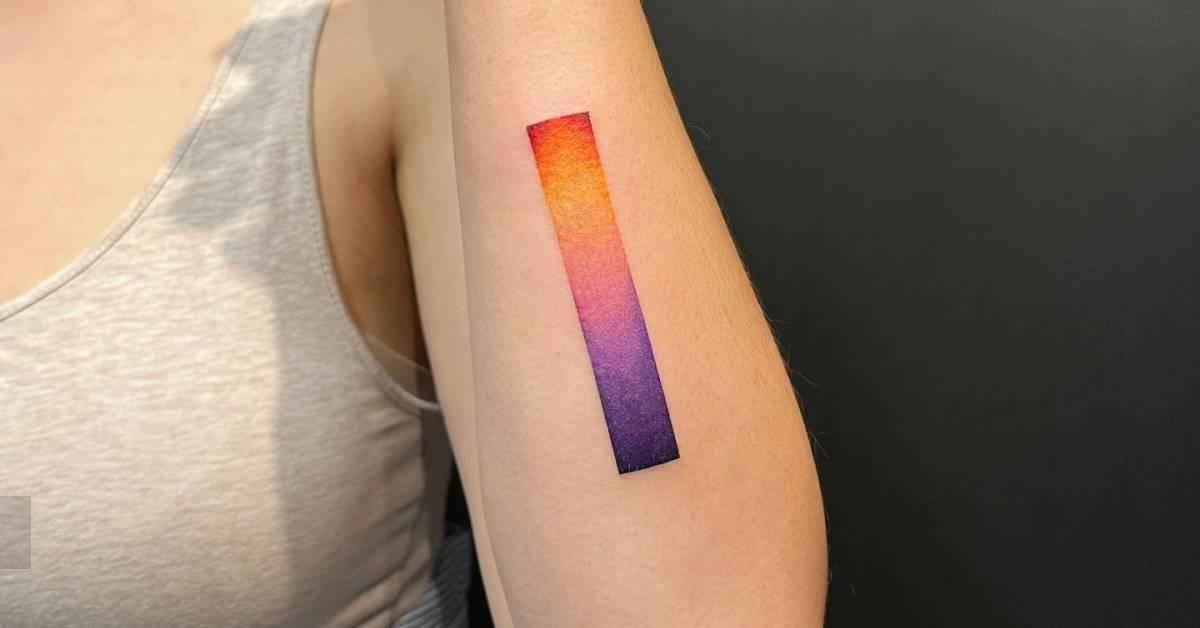 Spectrum tattoo done on the forearm, watercolor style.