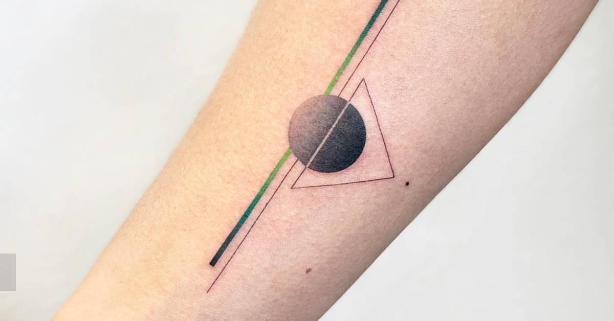 Geometric style abstract tattoo placed on the wrist.