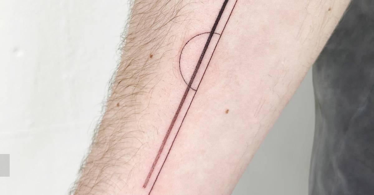 Abstract lines tattoo located on the inner forearm.