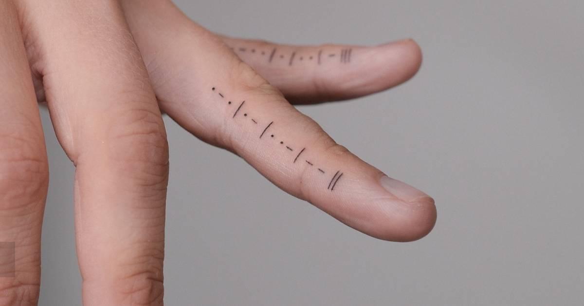 Morse code tattoo located on the finger, minimalistic