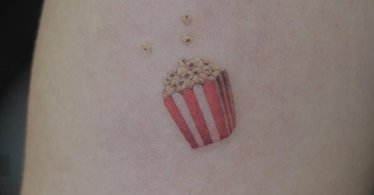 Popcorn tattoo in micro-realistic style located on the