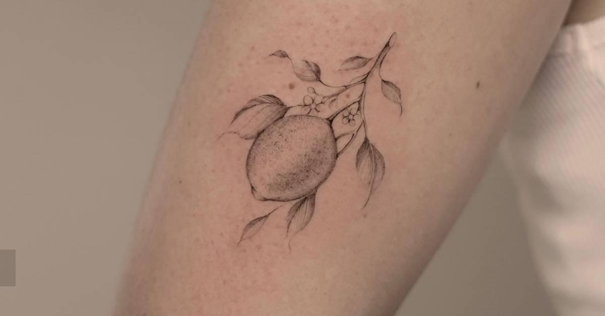 Illustrative style lemon tattoo located on the upper