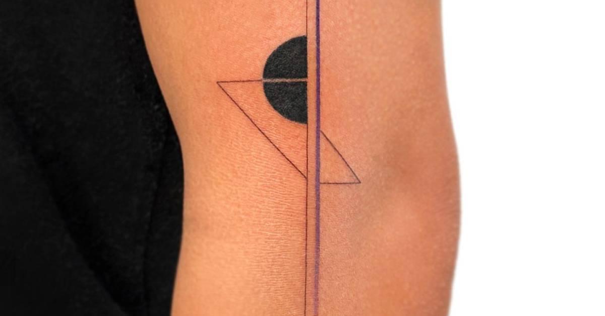 Abstract geometric tattoo located on the elbow.