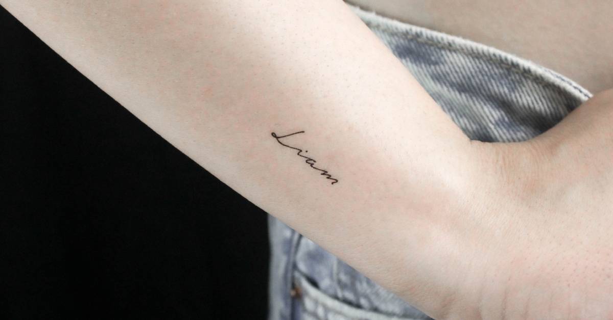 Name "Liam" temporary lettering tattoo located on the