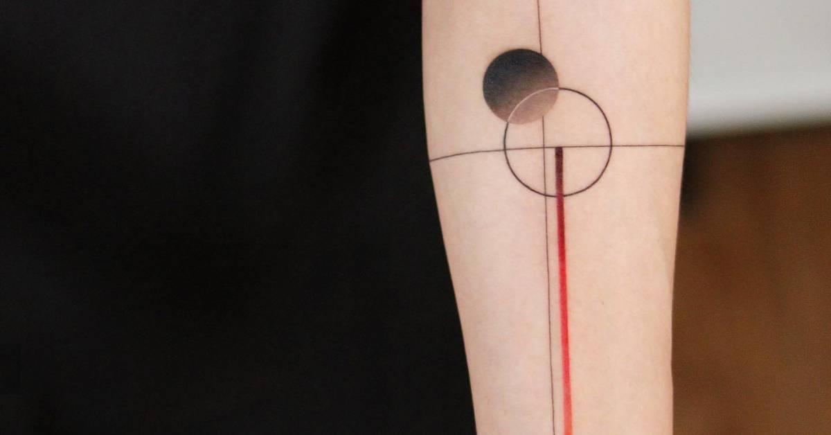 Abstract geometric tattoo located on the inner forearm.