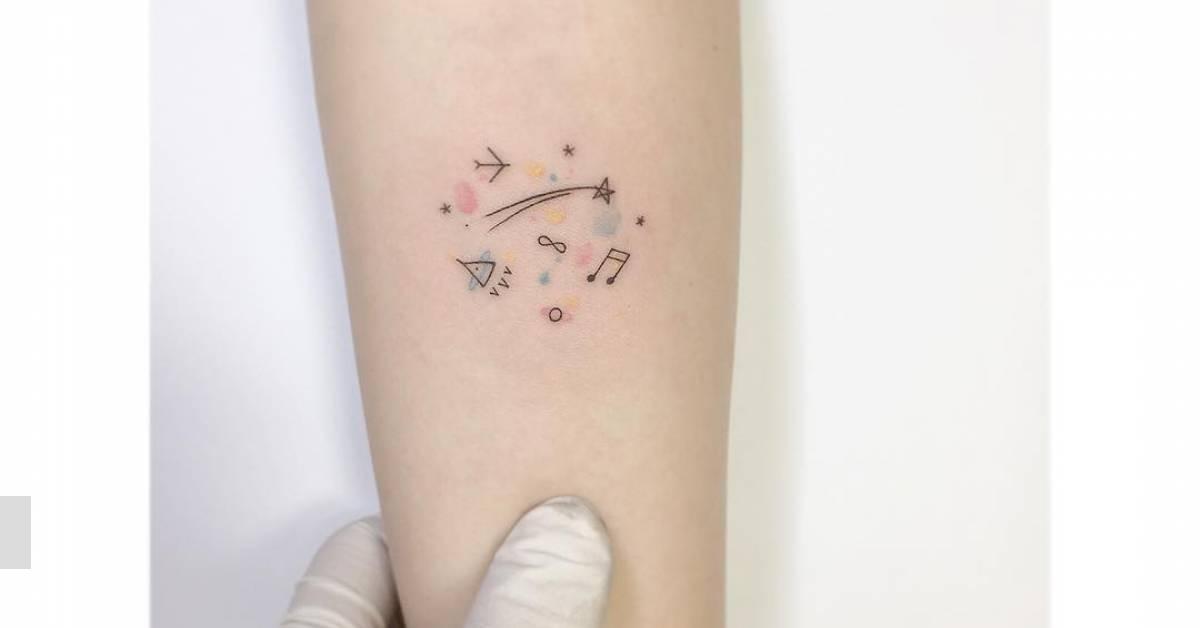 Minimalistic style universe tattoo located on the inner