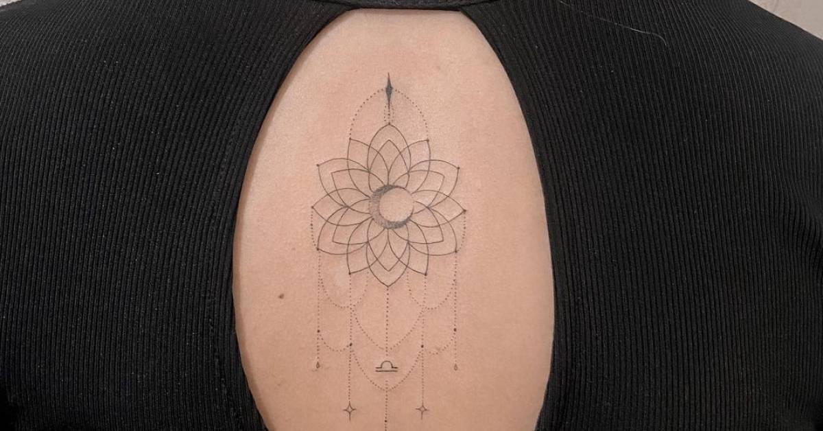 Fine line style mandala tattoo located on the upper