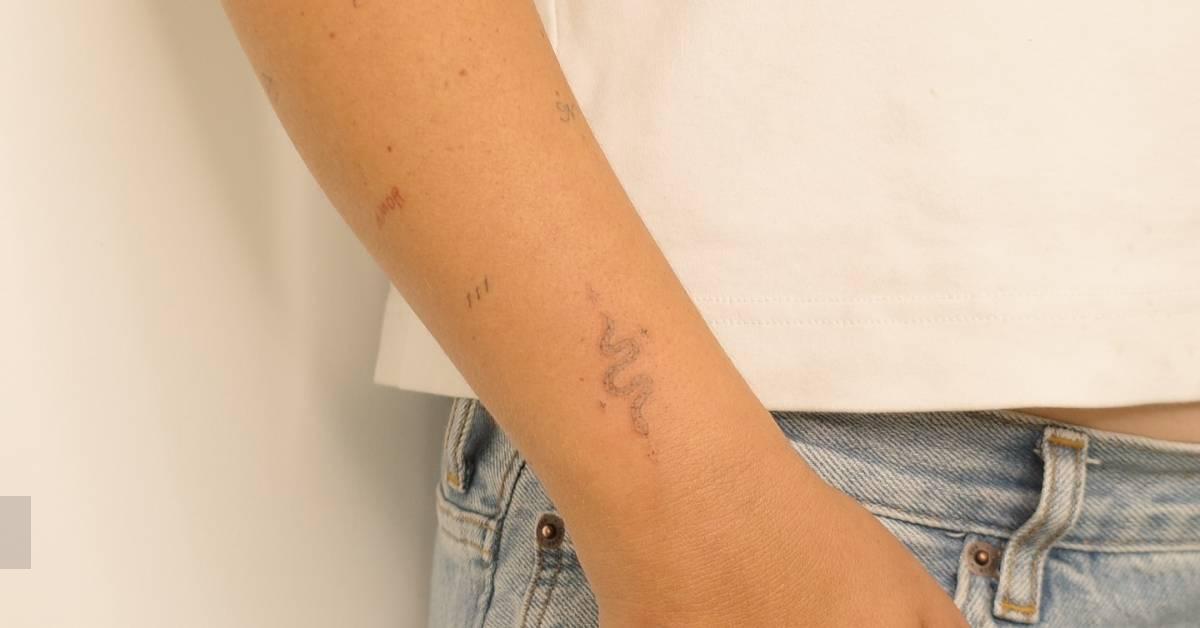 Fine line style forearm composition tattoos.