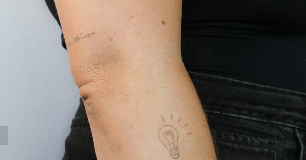 Fine line style arm composition tattoos.
