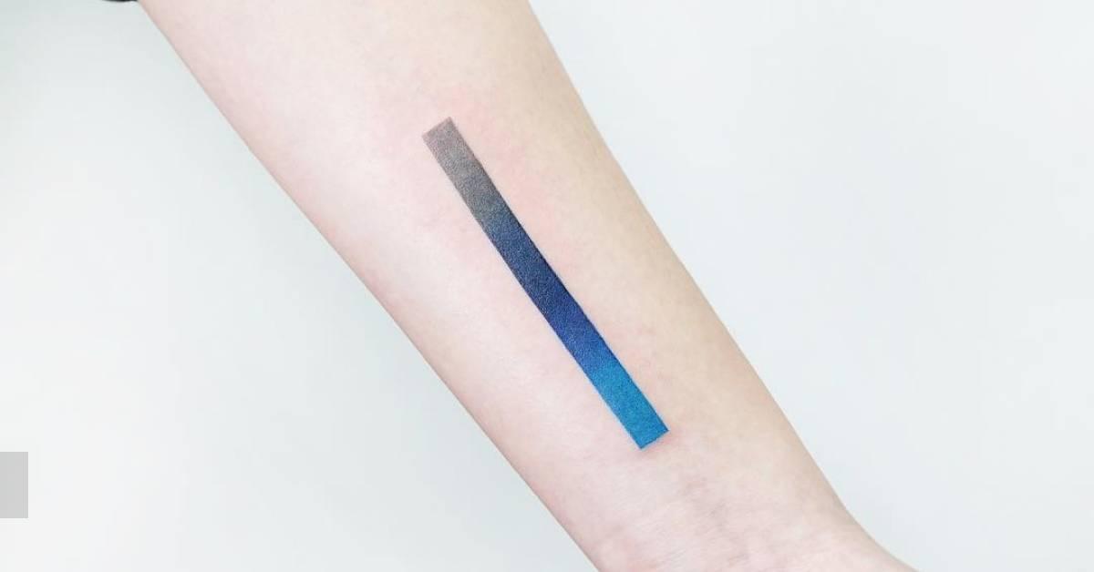 Spectrum tattoo located on the wrist, watercolor style.