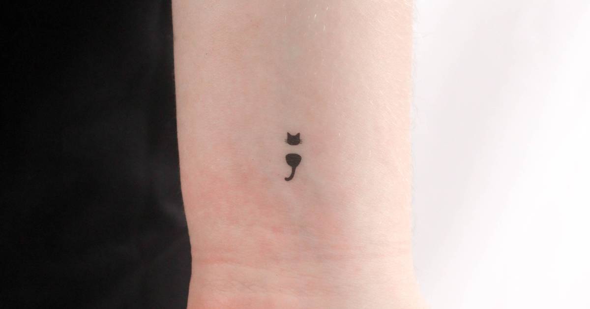 Little minimalistic cat semicolon temporary tattoo.