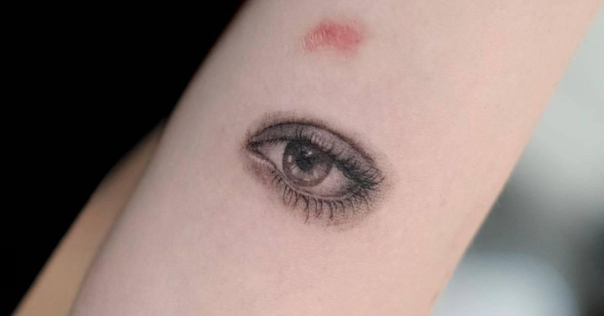 Micro-realistic eye tattoo placed on the inner arm.