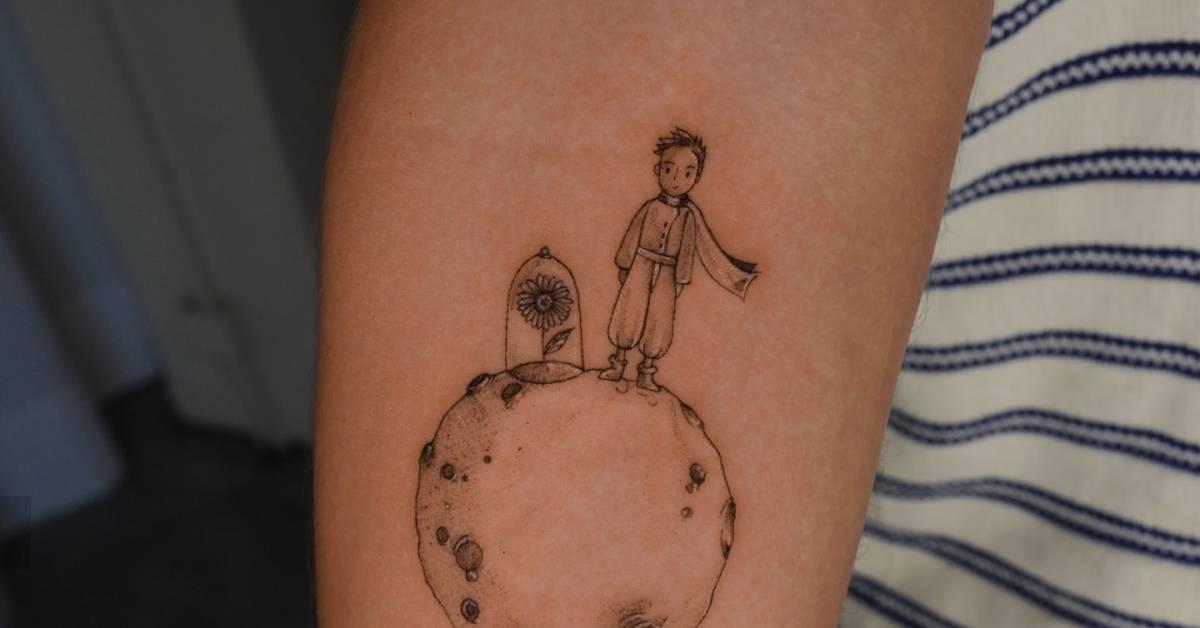 Cartoon style Little Prince tattoo located on the inner