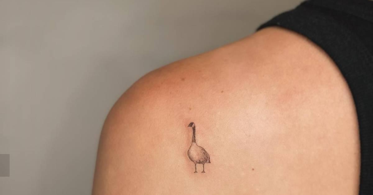 Canada goose tattoo located on the shoulder blade,
