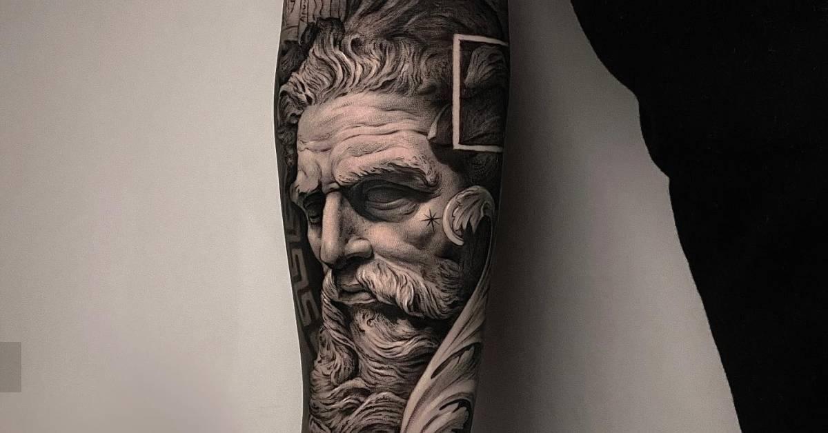 Bust of Neptune tattoo located on the inner forearm,