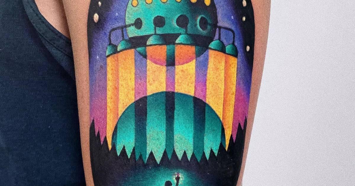 Pop art style alien abduction tattoo located on the