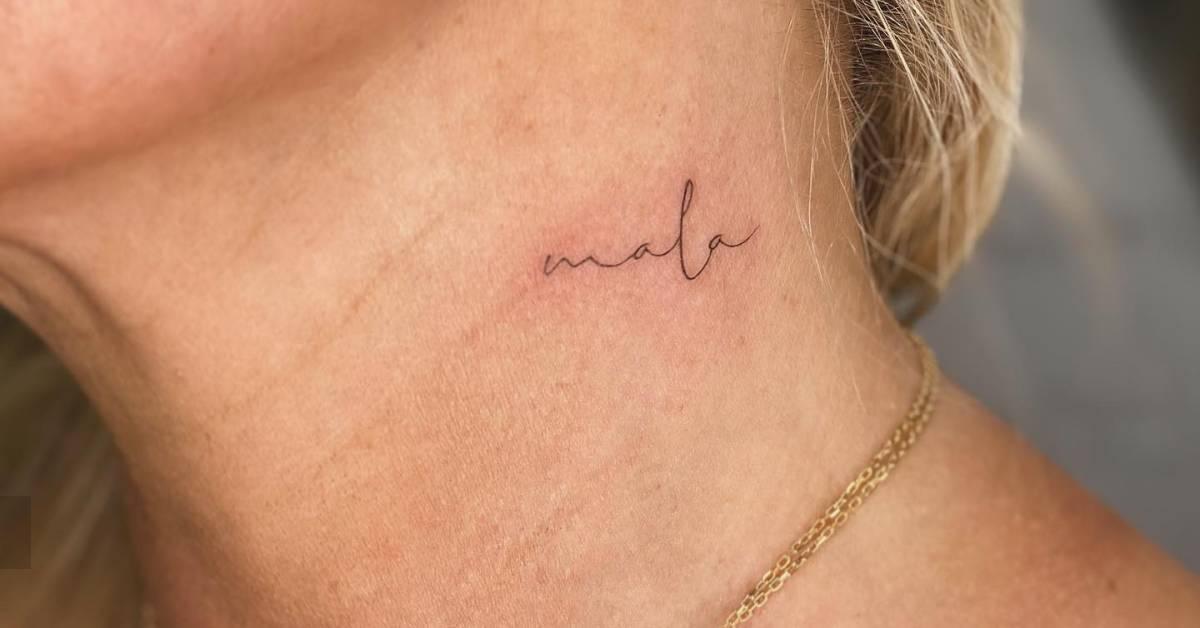"Mala" handwritten lettering tattoo located on the