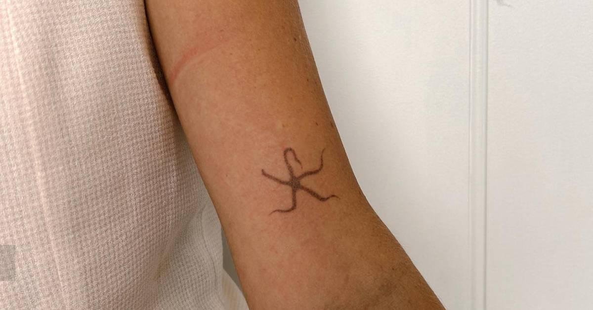 Dotwork style starfish tattoo located on the inner arm.