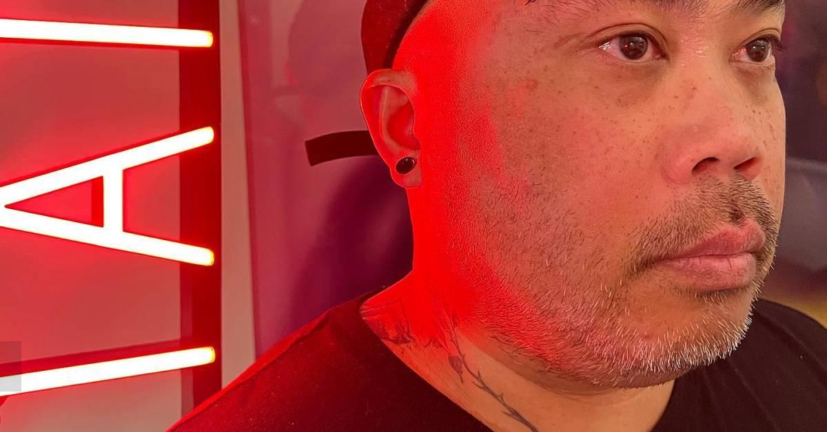 "Savior" lettering tattoo located on the face.