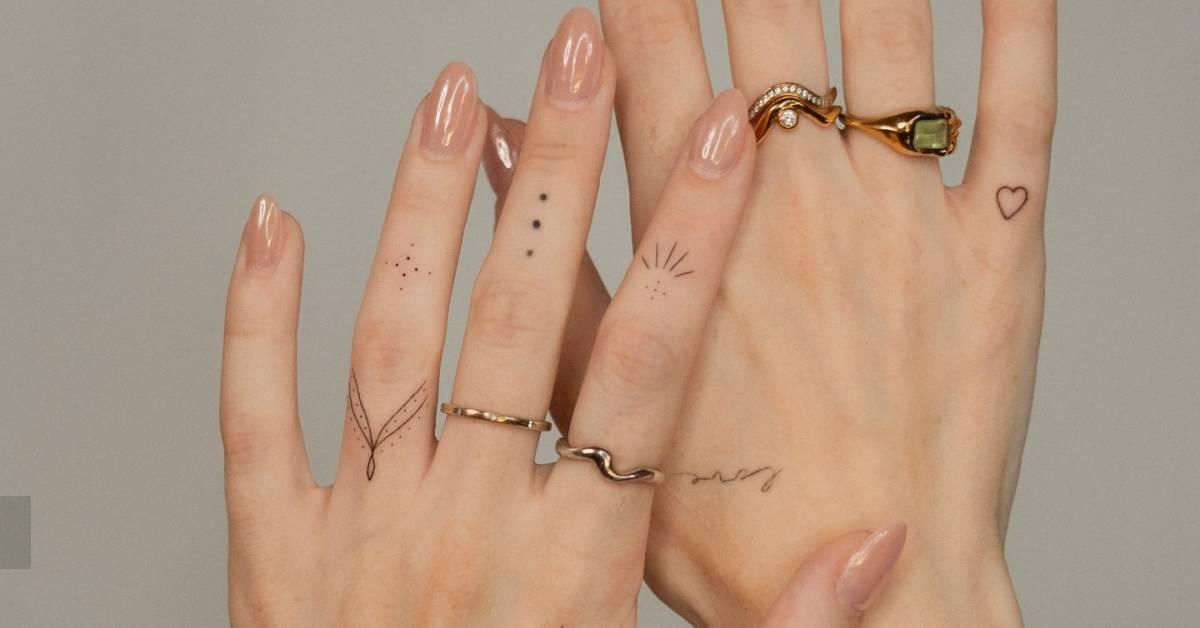 Individual matching hand composition tattoos.