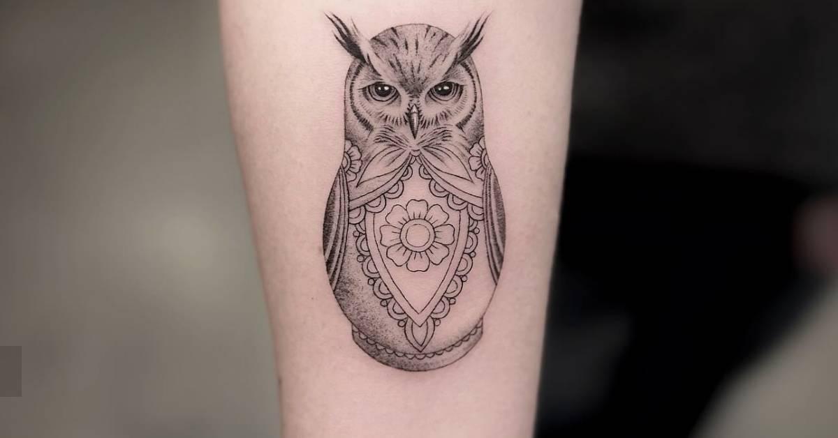 Owl Russian doll tattoo located on the inner forearm,