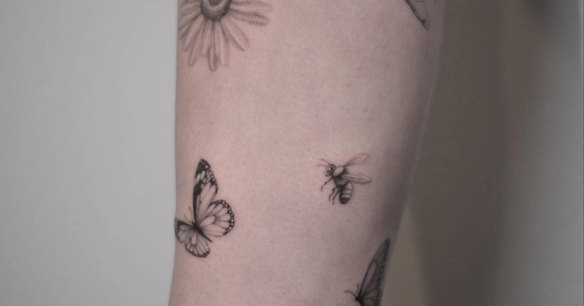 Michael Symon's forearm composition tattoos.