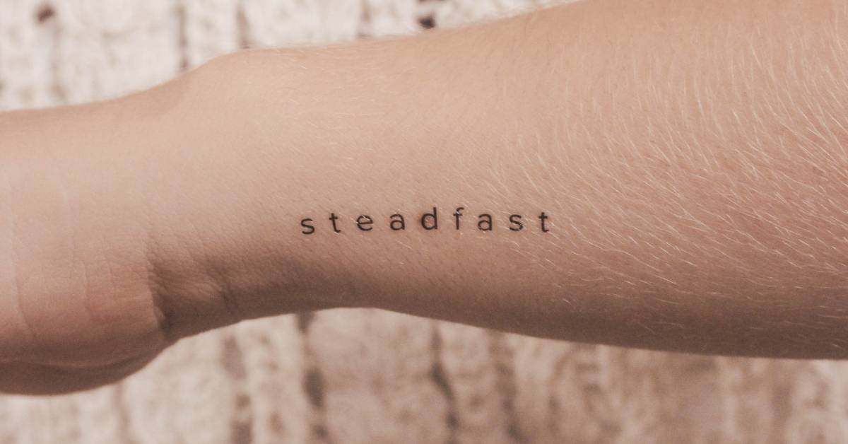 "Steadfast" temporary lettering tattoo located on the