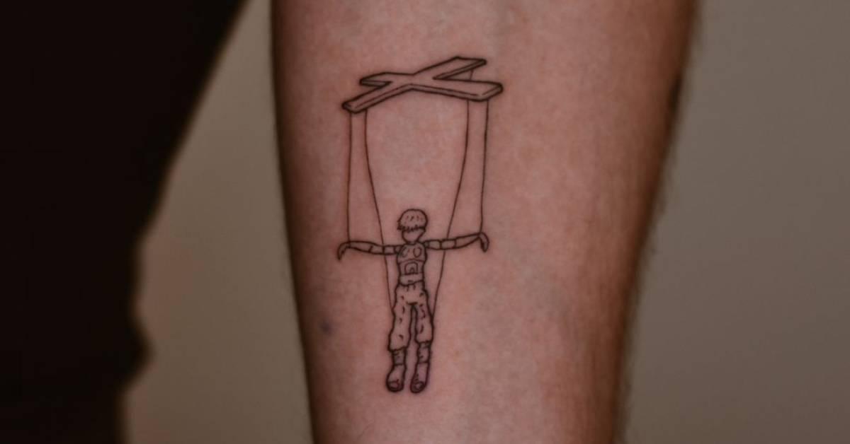 Illustrative style puppet tattoo located on the inner