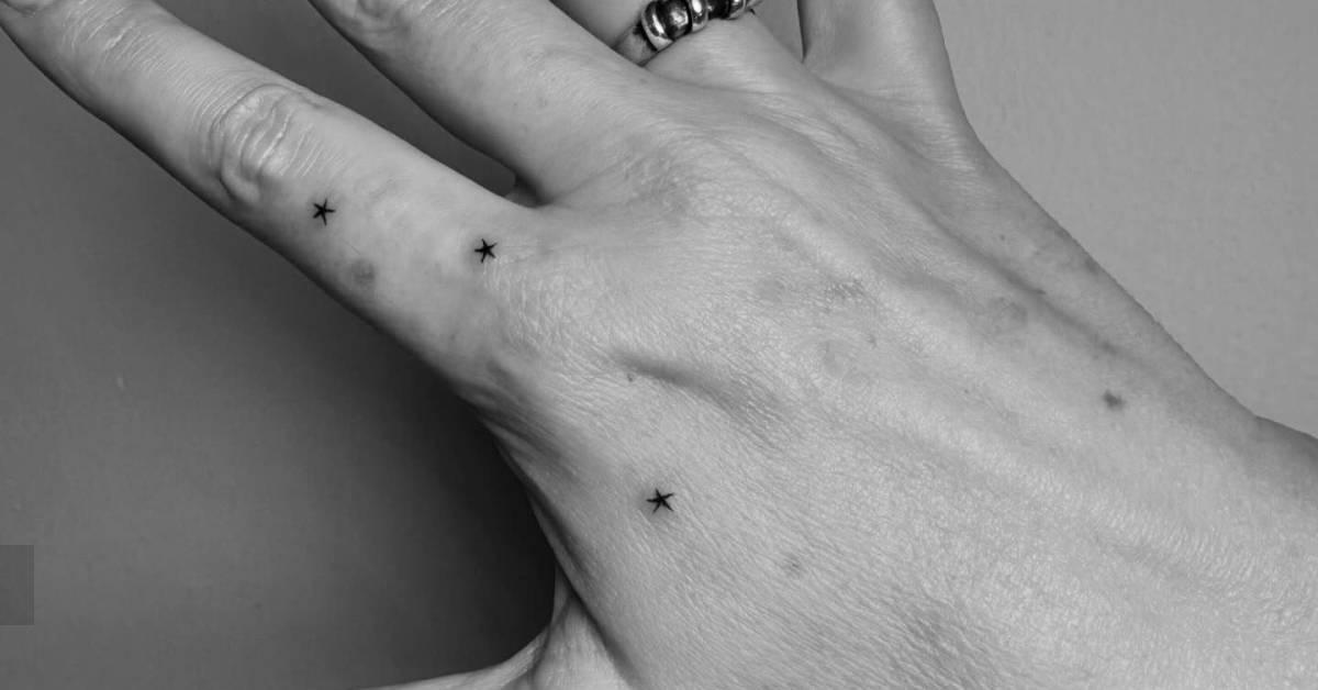 Minimalistic style stars tattooed on the hand.