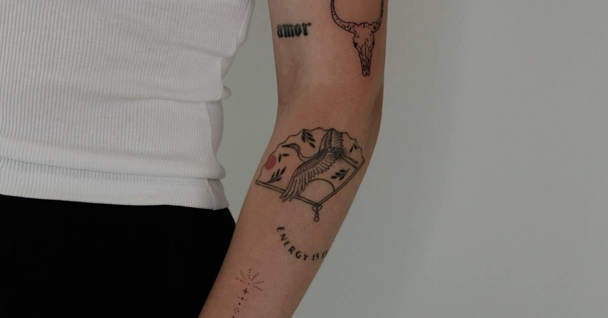 Illustrative style arm composition tattoos.