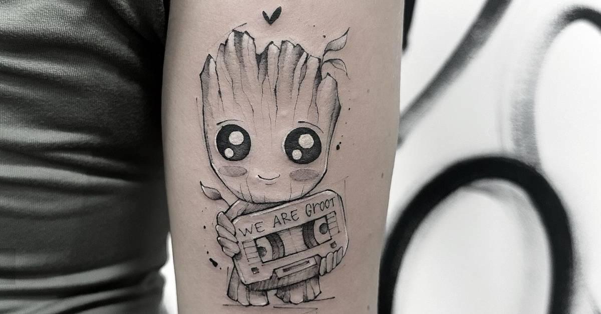 Cartoon style Groot tattoo located on the tricep.