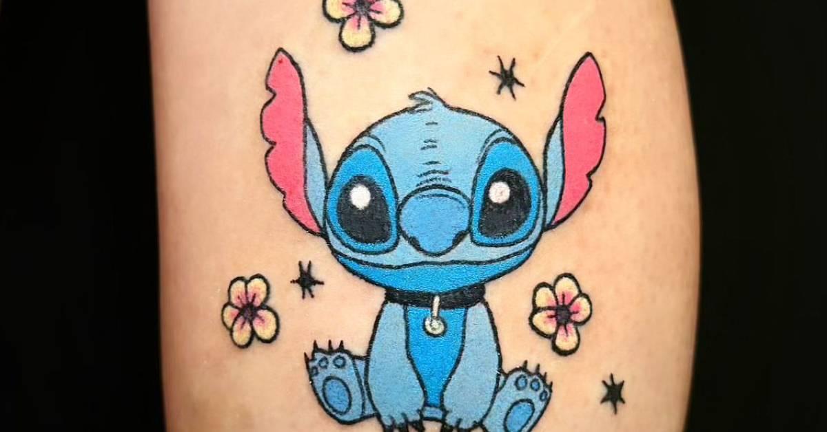 Cartoon style Stitch tattoo hand poked on the calf.