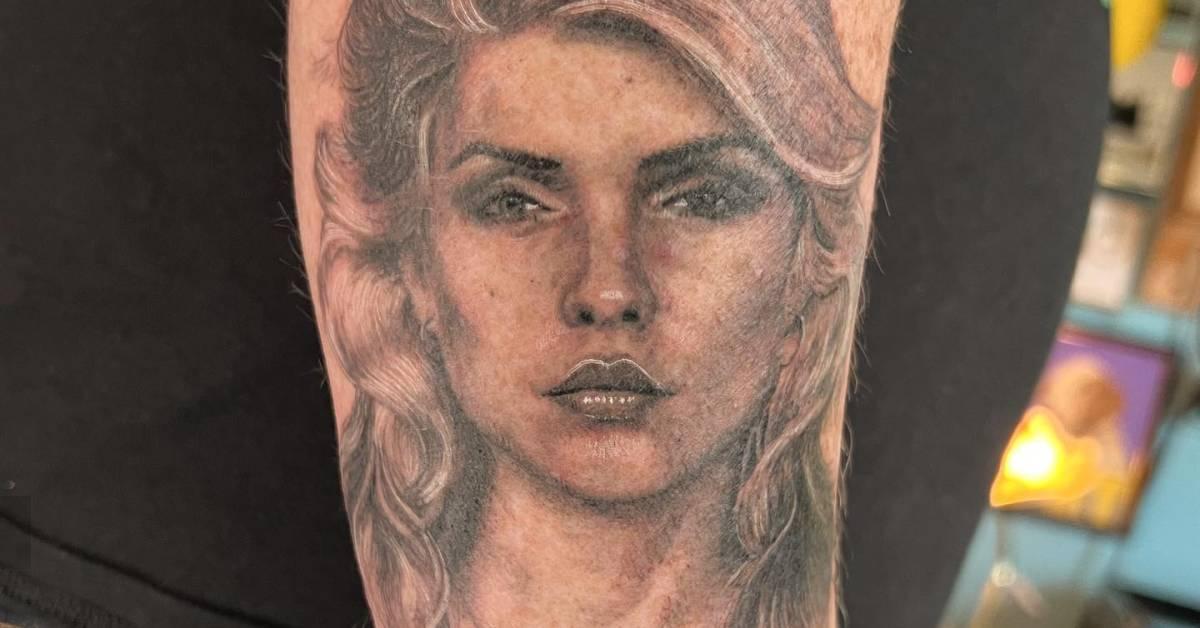 Black and grey Debbie Harry portrait tattooed on the