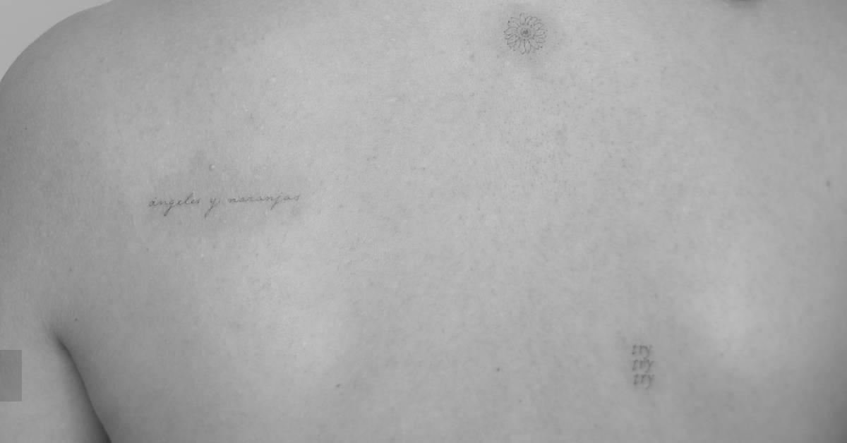 Fine line style back composition tattoos.