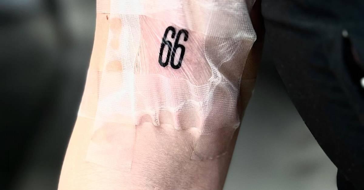 Number "66" tattoo located on the bicep.