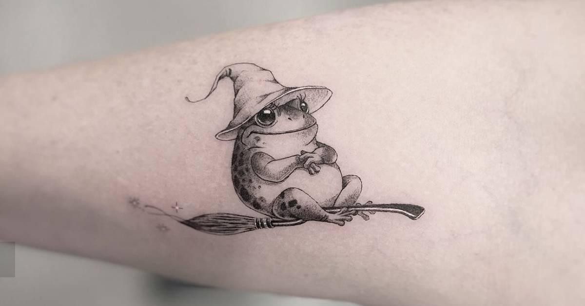 Witch frog tattoo located on the inner forearm.