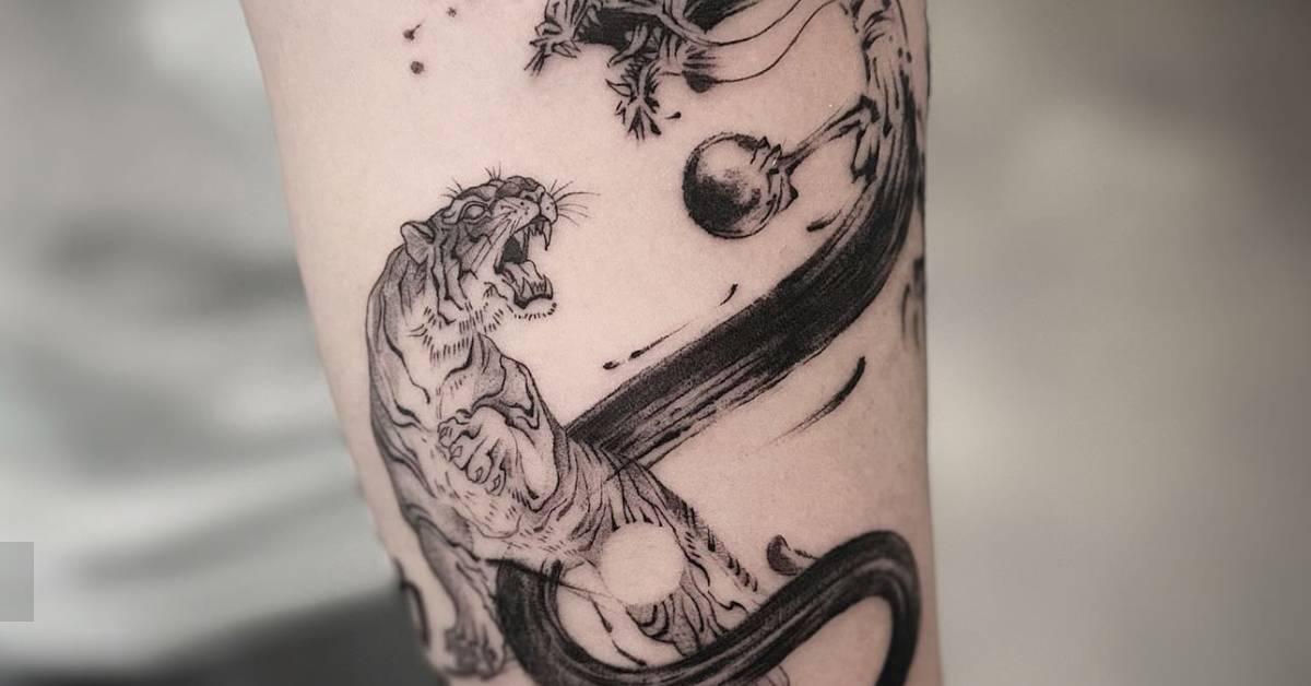 Tiger and dragon battle royale tattoo in watercolor
