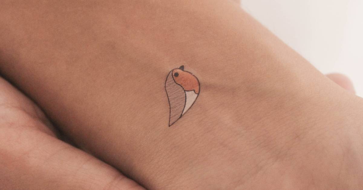 Tiny robin bird temporary tattoo located on the wrist.