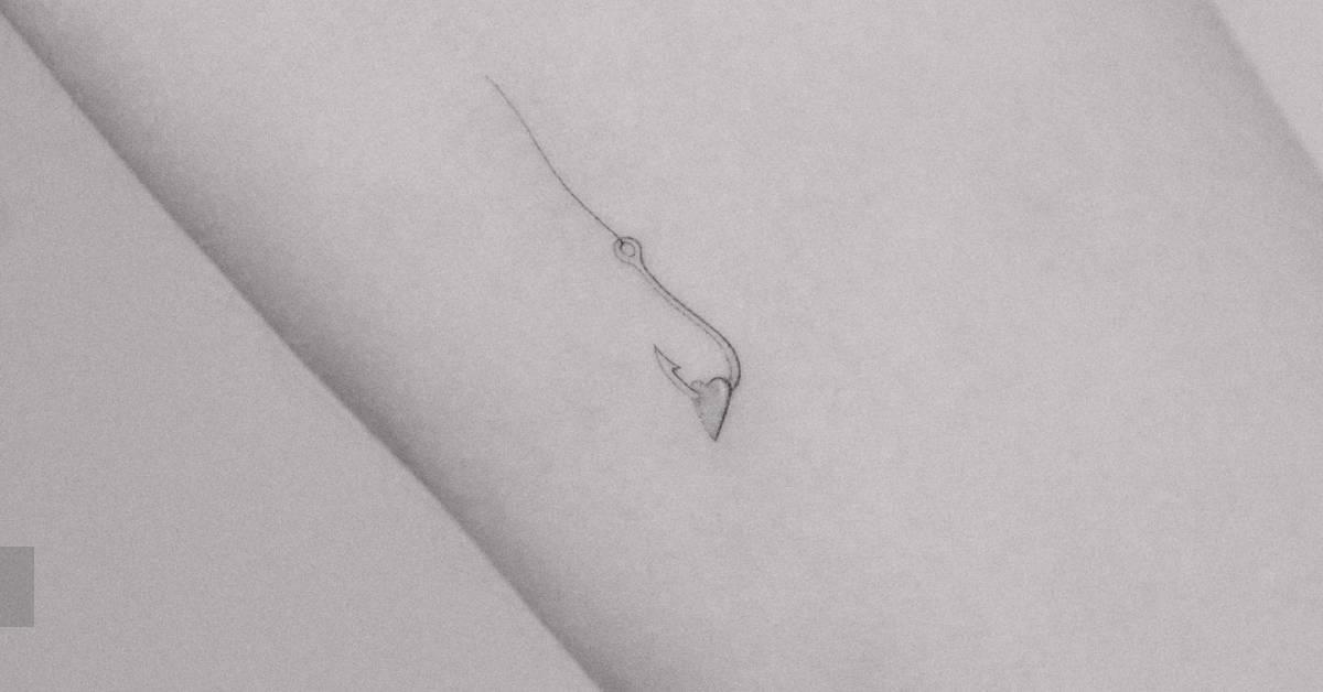 Single needle fish hook tattoo placed on the inner